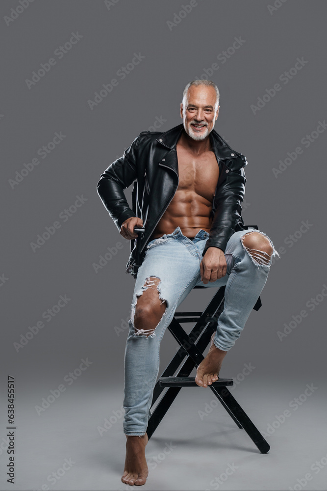 Masculine and stylish male model with striking physique, grey beard ...