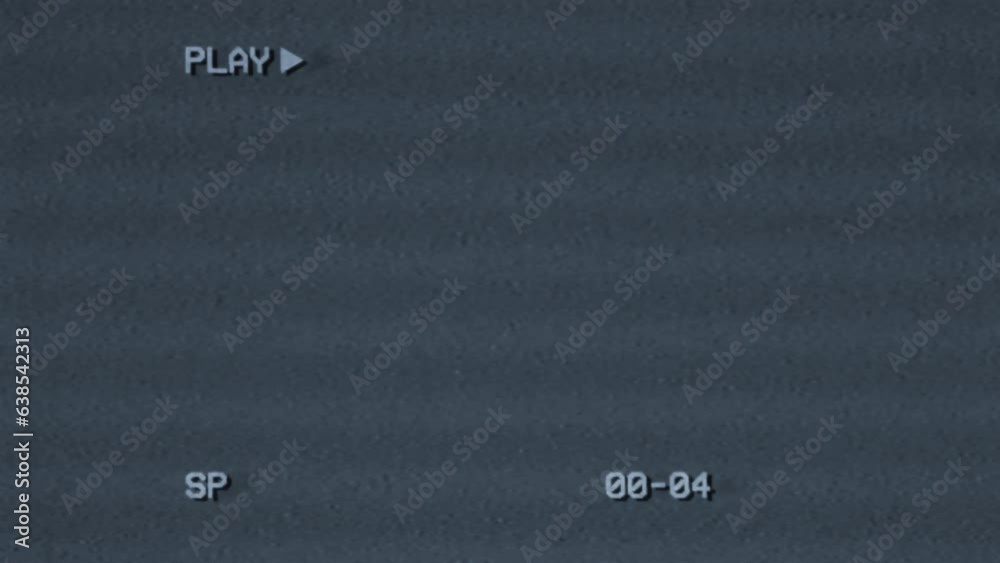 Playing an old, poor-quality VHS cassette. Old screen with text 'PLAY ...