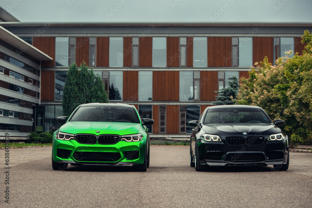 BMW M5 F90 and BMW F10 M5 Competition at the parking of business center ...