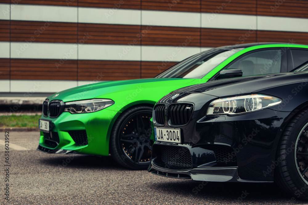 BMW M5 F90 and BMW F10 M5 Competition at the parking of business center ...