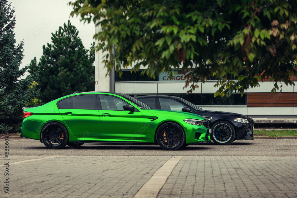 BMW M5 F90 and BMW F10 M5 Competition at the parking of business center ...