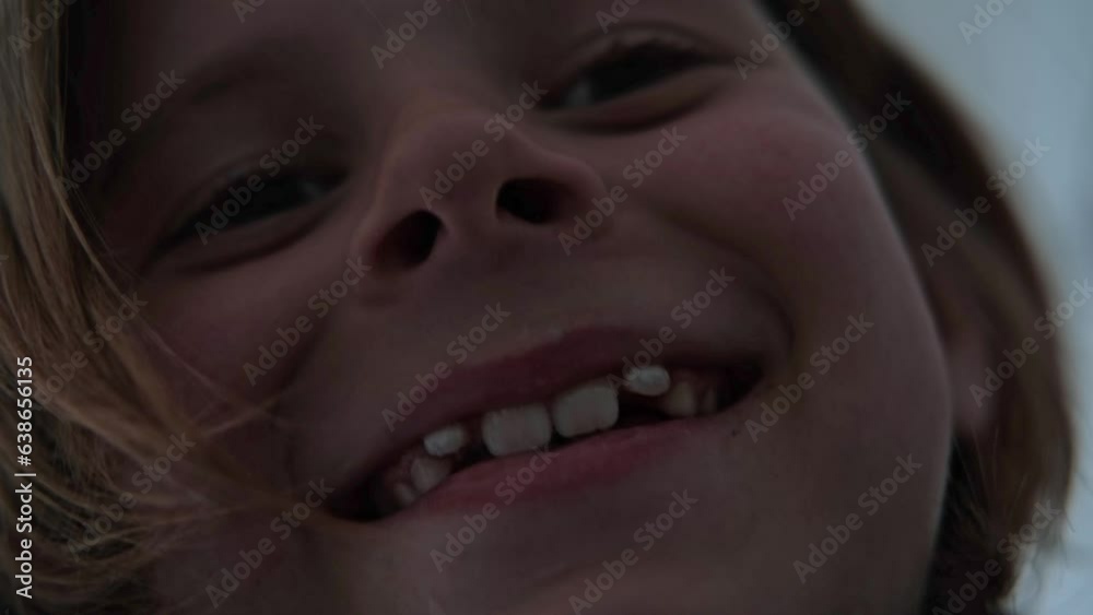 A young boy is filming himself. Full screen face, close-up. Boy 9 years ...