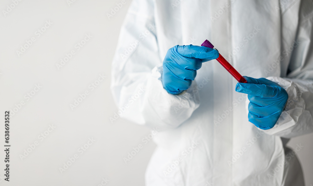 medical scientist Chemist researcher holding a blood sample tube doing ...