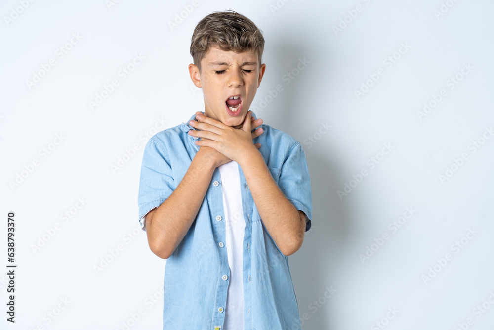 Beautiful kid boy wearing casual clothes shouting suffocate because ...