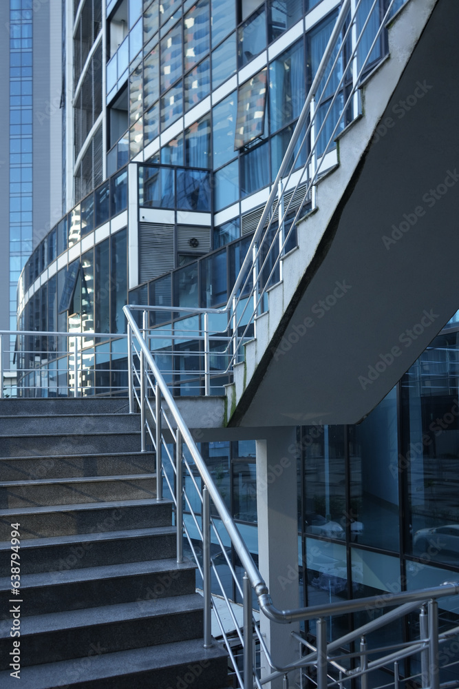 empty Modern design metal staircase with concrete and glasses office ...