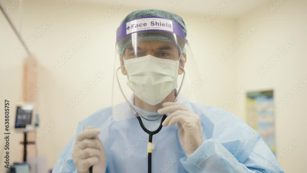male doctor wearing mask face shield PPE suit worker in a white robe ...