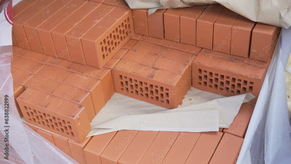 Red brick. Construction of a brick building. silica product. Pallet ...