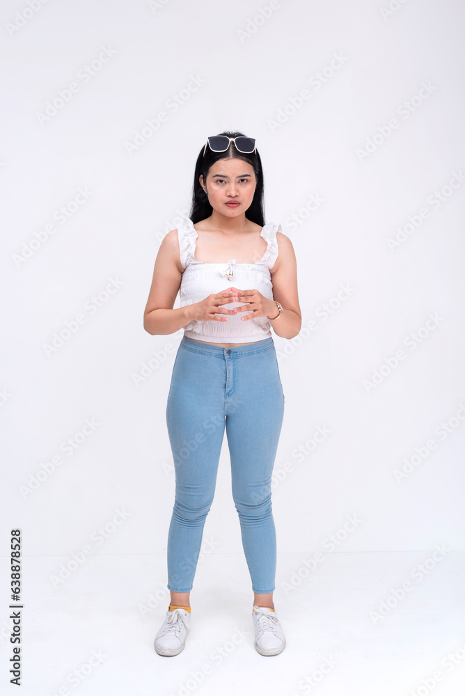 A humbled young asian woman asking for help and assistance, making a ...