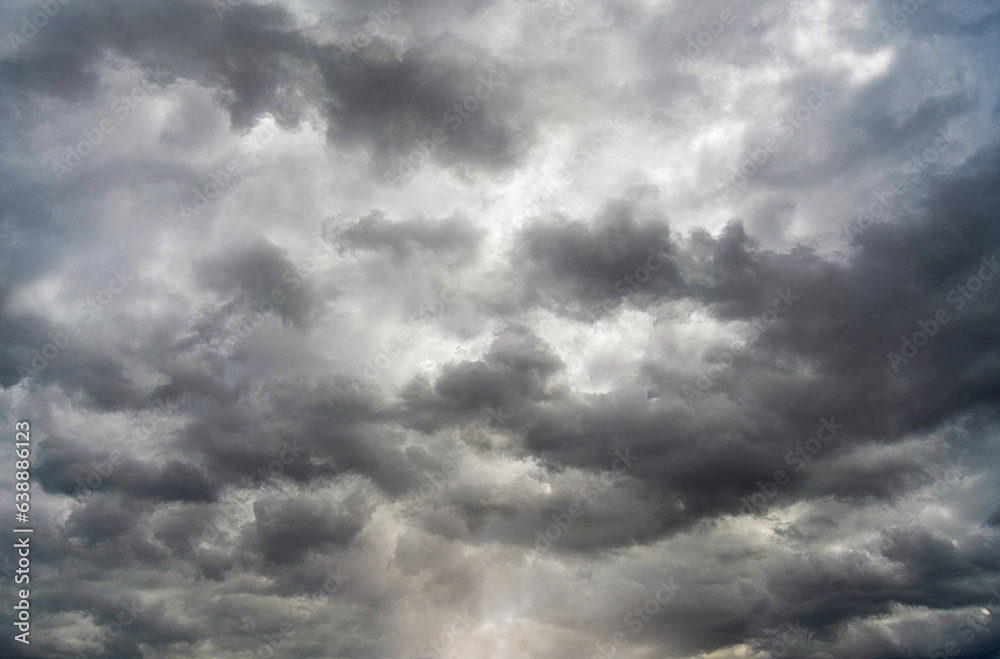 Before a thunderstorm. Large gray storm cloud on a cloudy sky ...