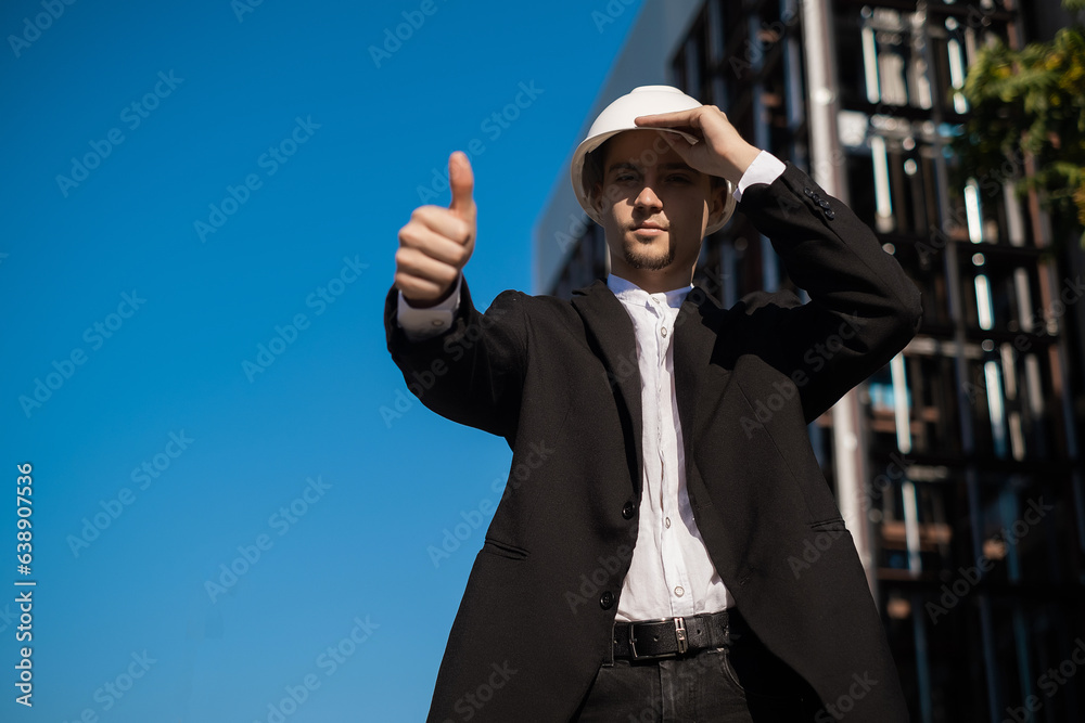 male foreman at construction site showing thumbs up, like, cool job ...