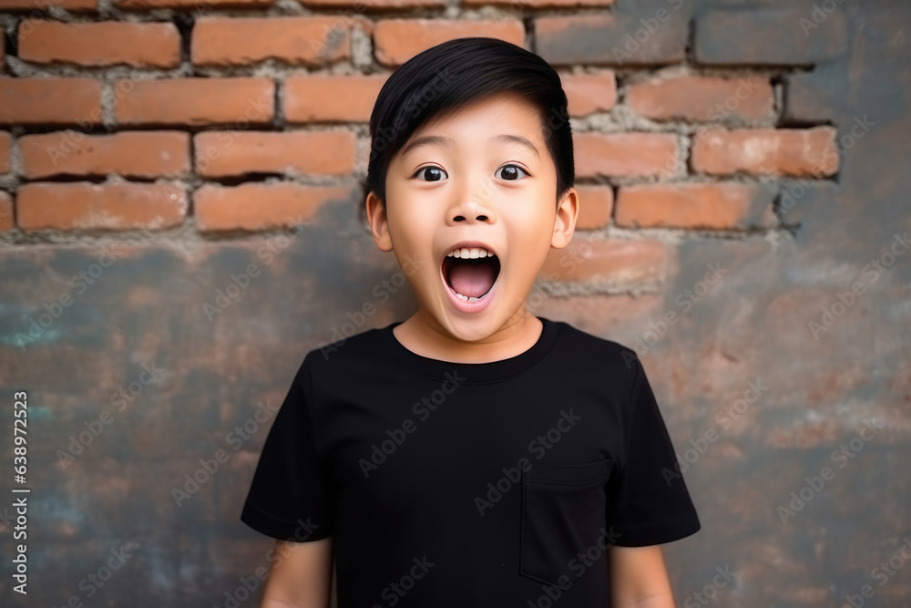 Surprise Asian Boy In Black Polo Shirt On Brick Wall Background ...