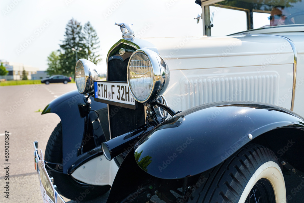 A vintage Ford Model A stands in the parking lot. Front view of the ...
