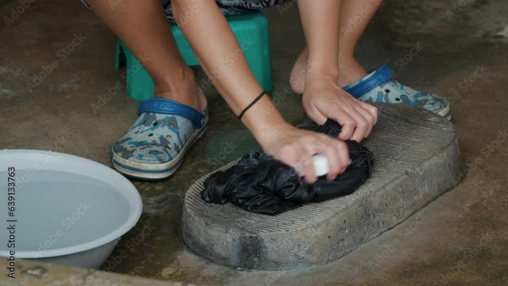 North Korean Woman's Hands Scrubbing and Washing Clothes with Soap on ...