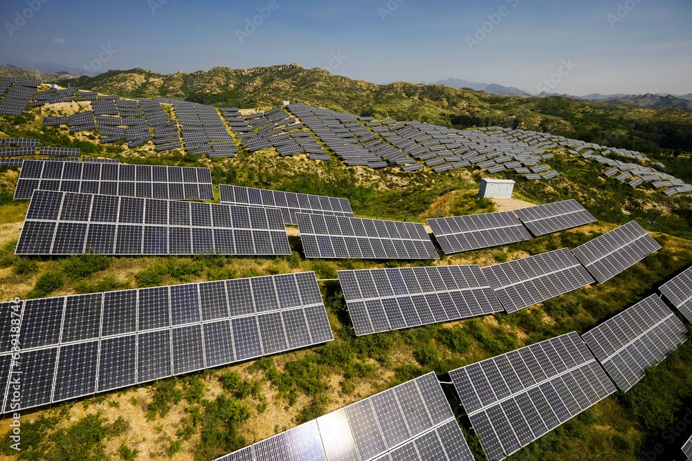 Aerial photography of solar photovoltaic cells built on a hillside ...