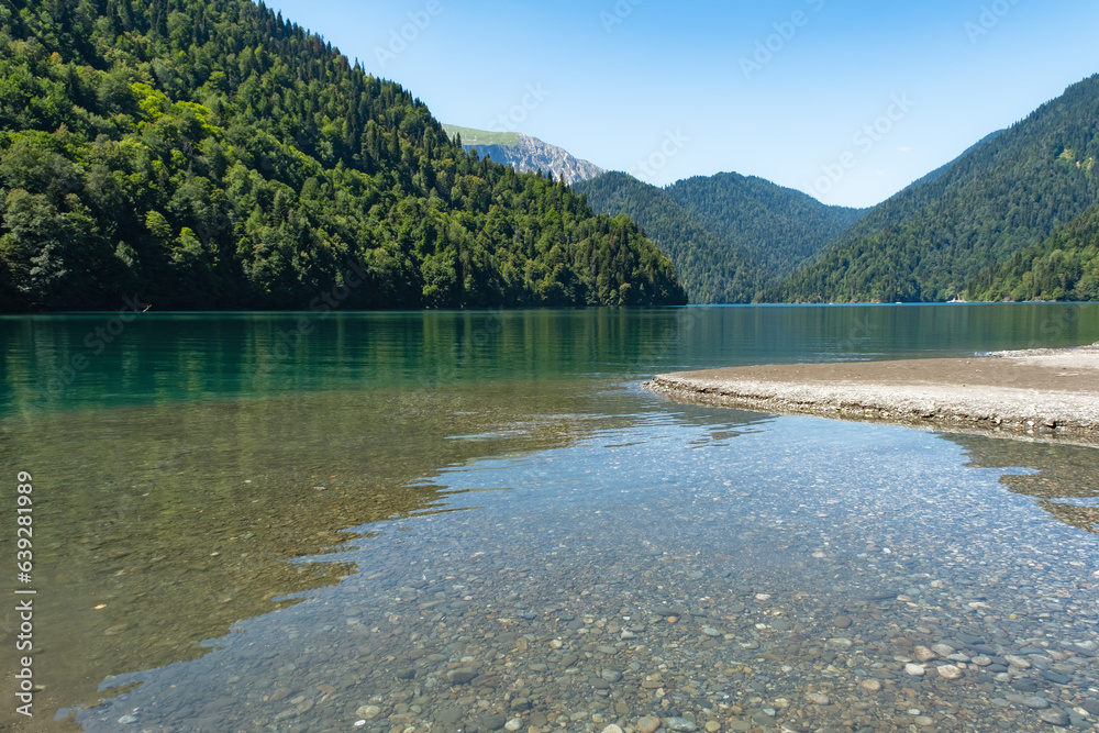 Beautiful mountain Lake Ritsa. Lake Ritsa in the Caucasus Mountains, in ...