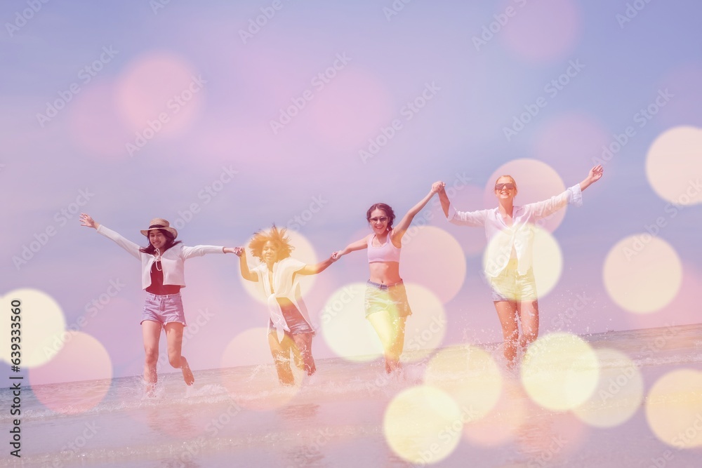 Four happy friends at sunset beach party runs to water, Silhouette ...