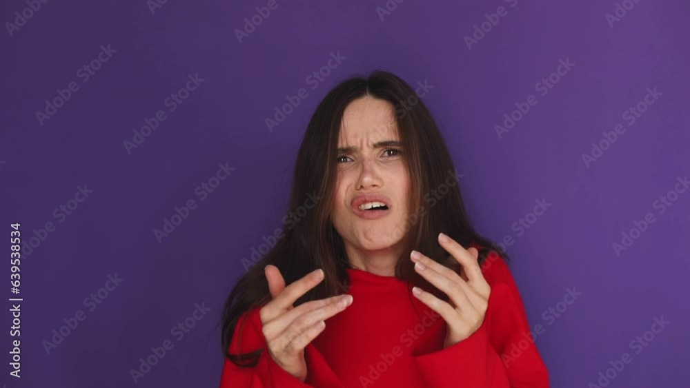 Worried brunette woman watching scary horror movie shock surprise ...