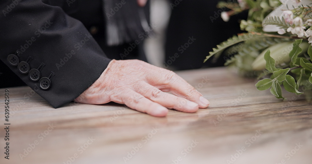 Death, funeral and hand on coffin in mourning, family at service in ...