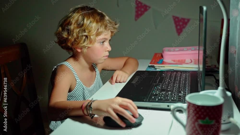 Caucasian child school student boy or girl studying at home using ...