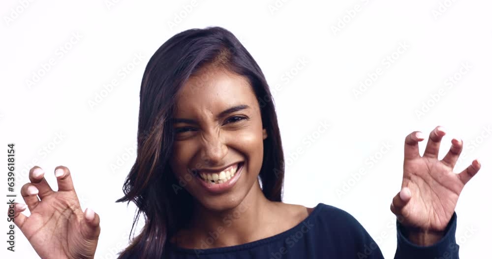 Hands, face and a woman with a roar on a white background for playful ...