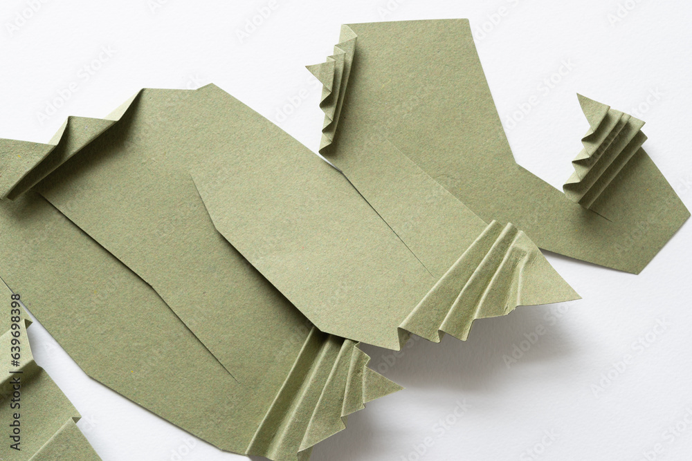 abstract rough green paper shape with folded tips or flaps and cut ...