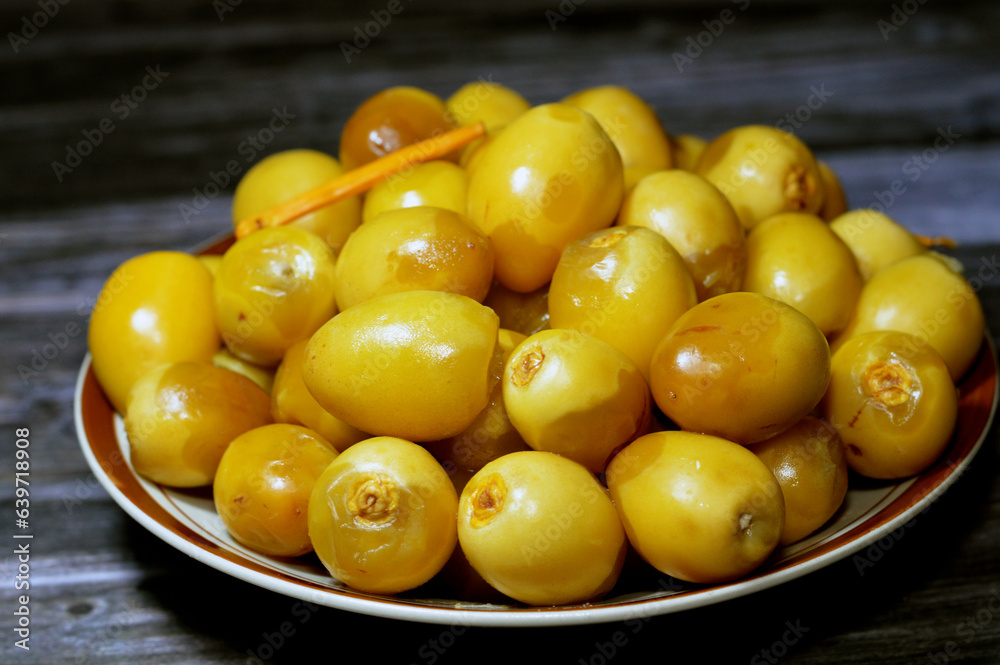 Yellow Barhi dates, botanically classified as Phoenix dactylifera ...