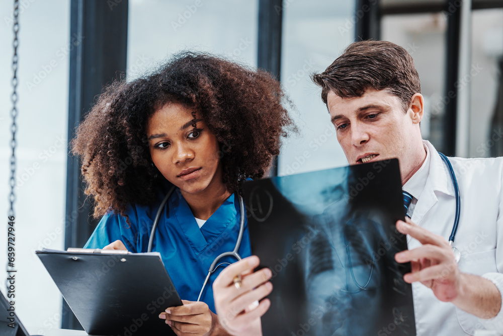 Medical staff team african american meeting discussing chest x-ray film ...