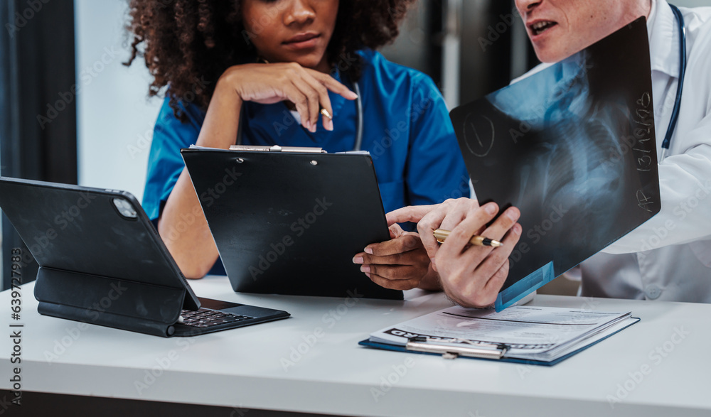 Medical staff team african american meeting discussing chest x-ray film ...