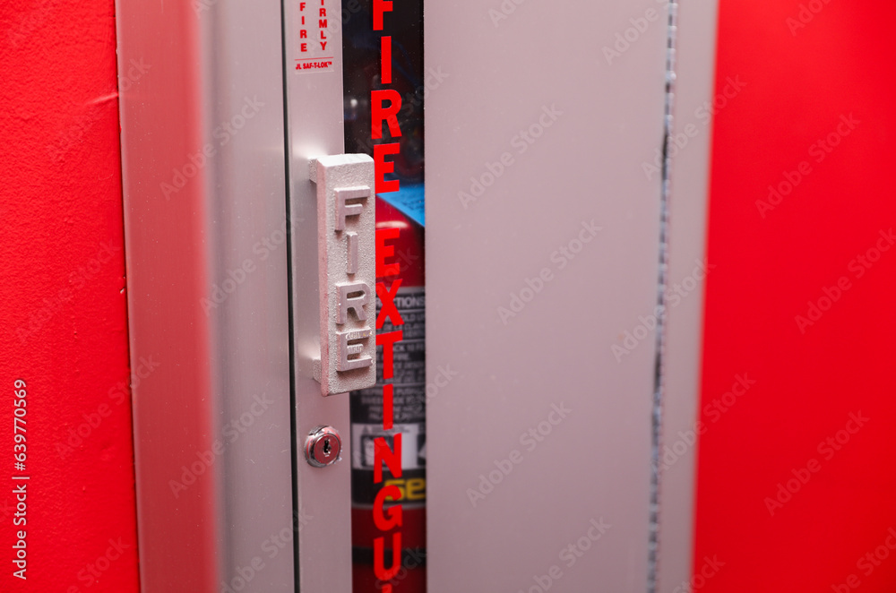 Fire extinguisher and sign depicting safety, urgency, preparedness, red ...
