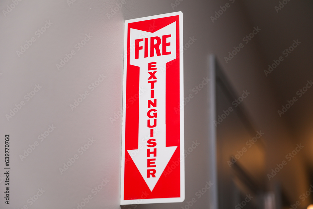 Fire extinguisher and sign depicting safety, urgency, preparedness, red ...