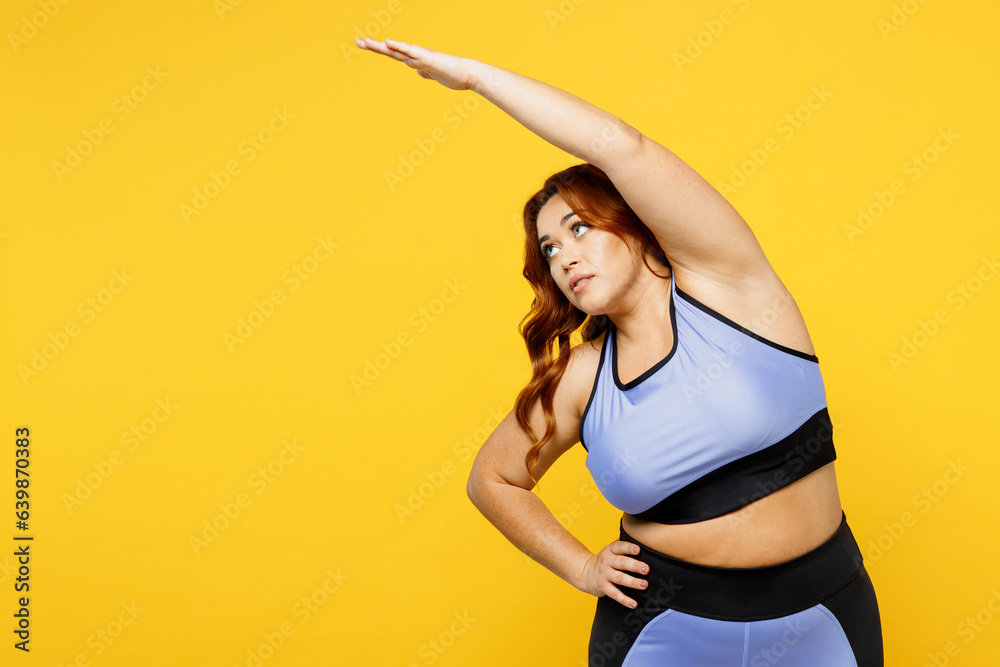 Young overweight plus size fat fit woman wear blue top warm up training ...