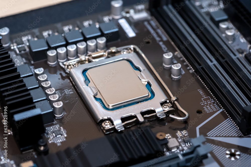 Modern CPU processor installed on a brand new motherboard, object ...