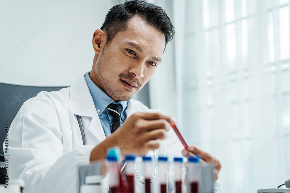 Clinical Laboratory Tests, Asian hematologist checking medically ...