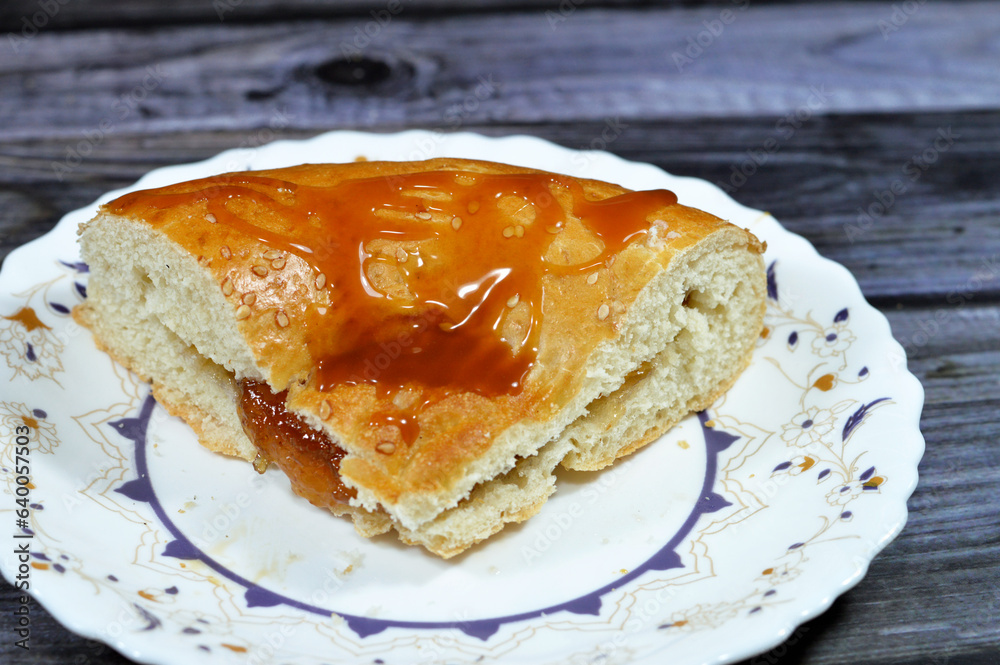 Caramel sauce and fig jam with a tandyr nan Uzbek bread, a type of ...