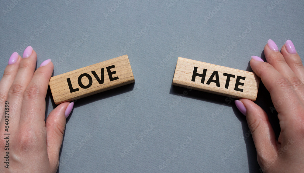 Love vs Hate symbol. Concept word Love vs Hate on wooden blocks. Businessman hand. Beautiful ...