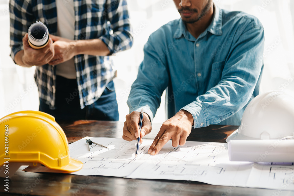 Engineer teams meeting working together wear worker helmets hardhat on ...