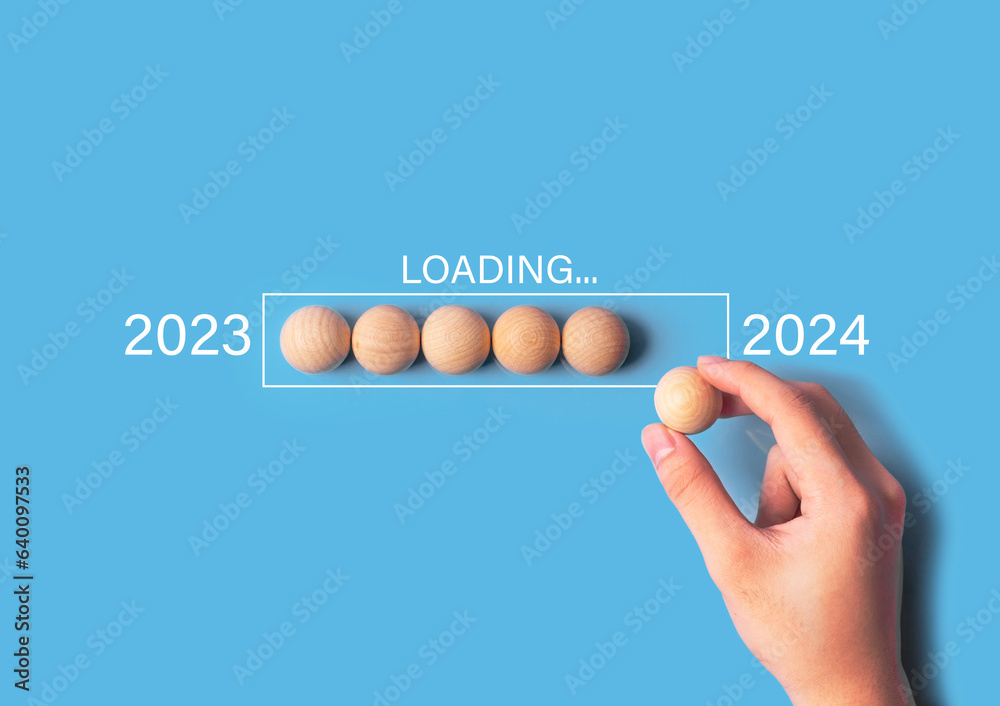 start and countdown concept. Hand putting wood circle in loading ...