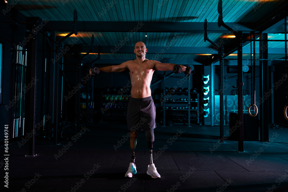 Shirtless young man with prosthetic legs working out in gym Stock Photo ...