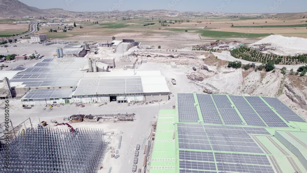 Industrial buildings of open pit limestone mine with solar photovoltaic ...