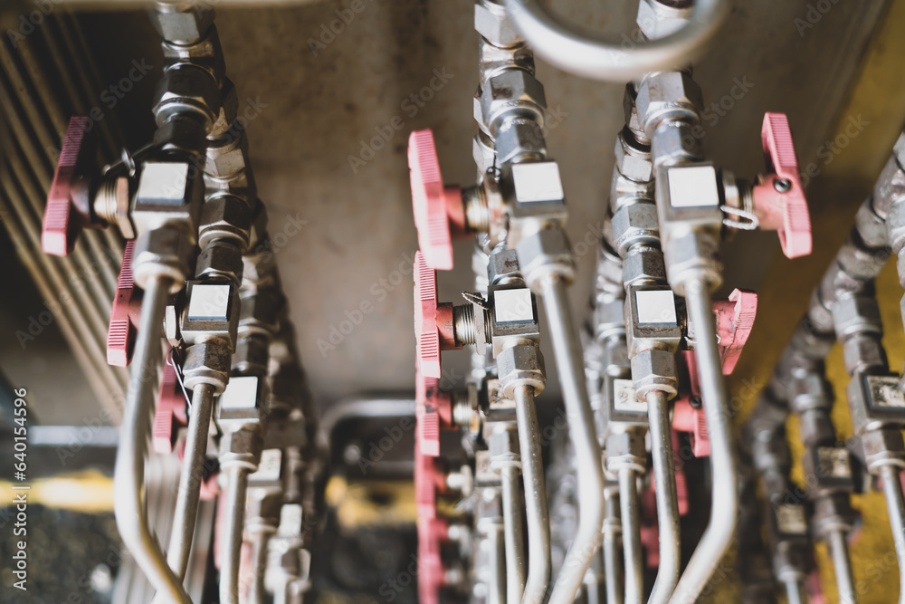 Variable hydraulic actuators of small metal pipes Stock Photo | Adobe Stock