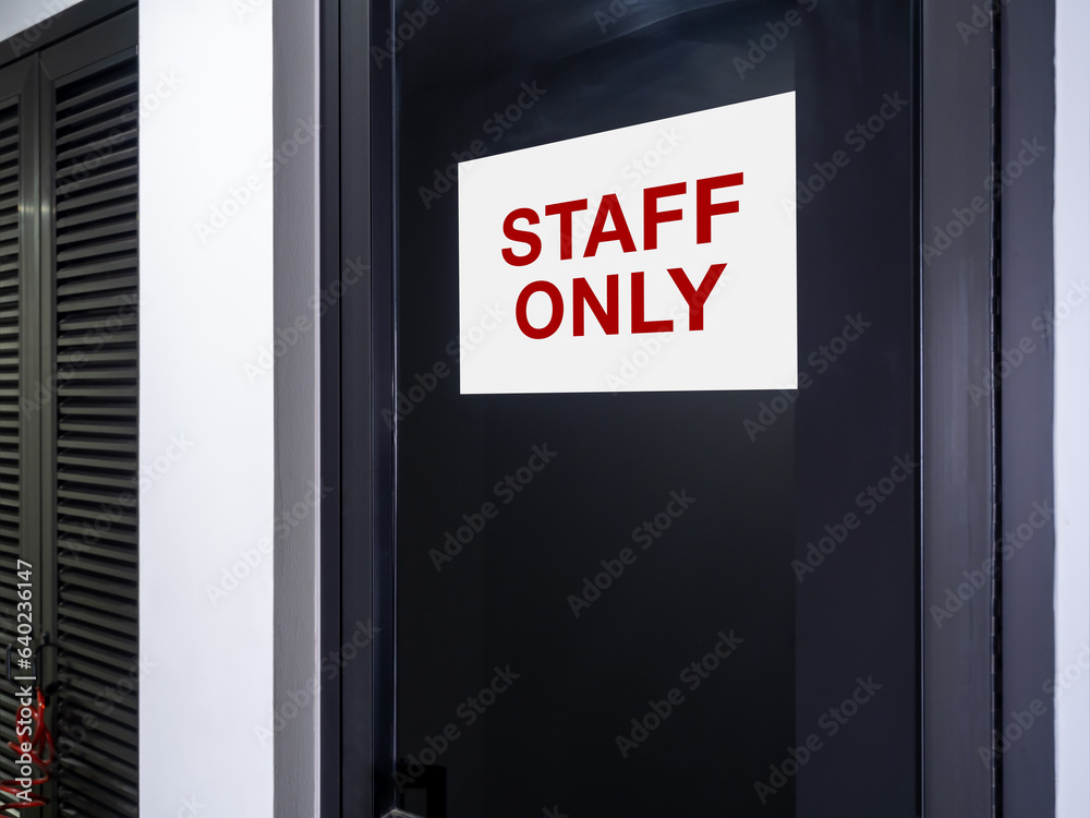 Staff only area notice sign. Text "STAFF ONLY" sticker notification ...