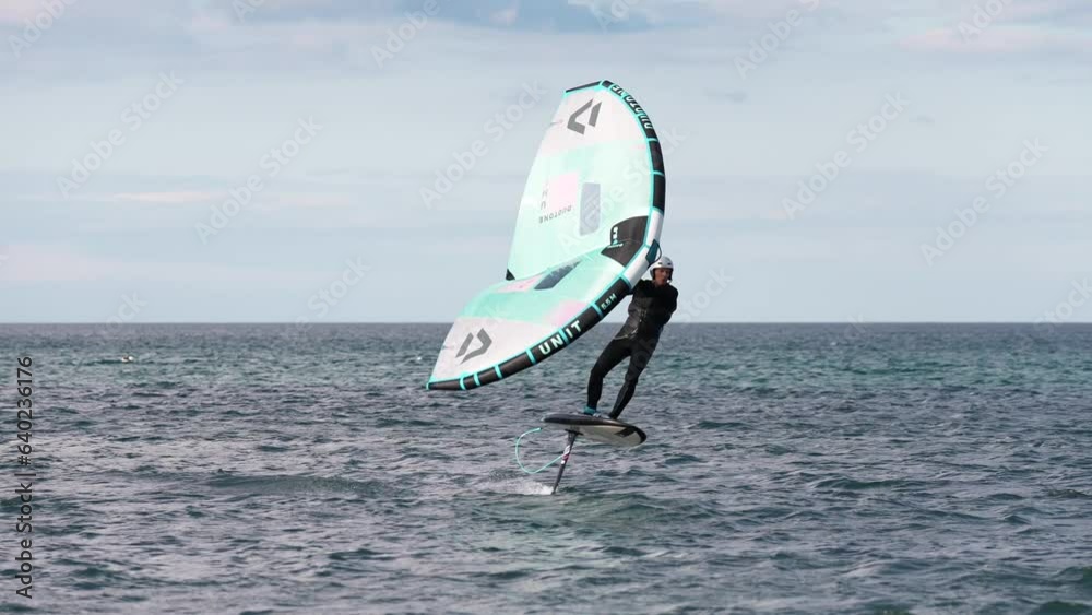 Modern water sport. Hydrofoil ride on the ocean using the wing and the ...