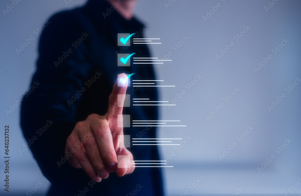 Businessman pressing to tick mark in checkbox for quality document ...