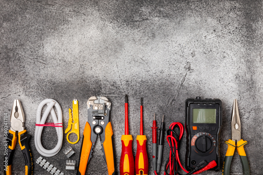 Electrician equipment on black textured background with copy space.Top ...