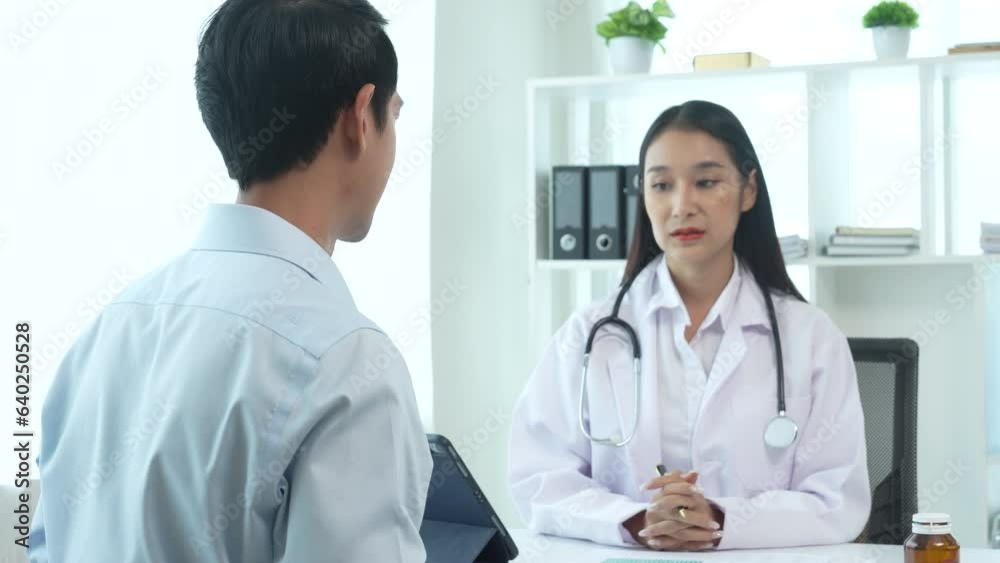 4k slow motion of asian female doctor specialist and male patient ...