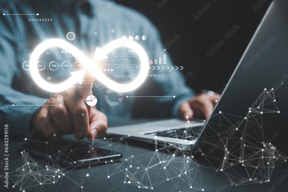 Businessman highlights infinity symbol, signifying limitless connection ...