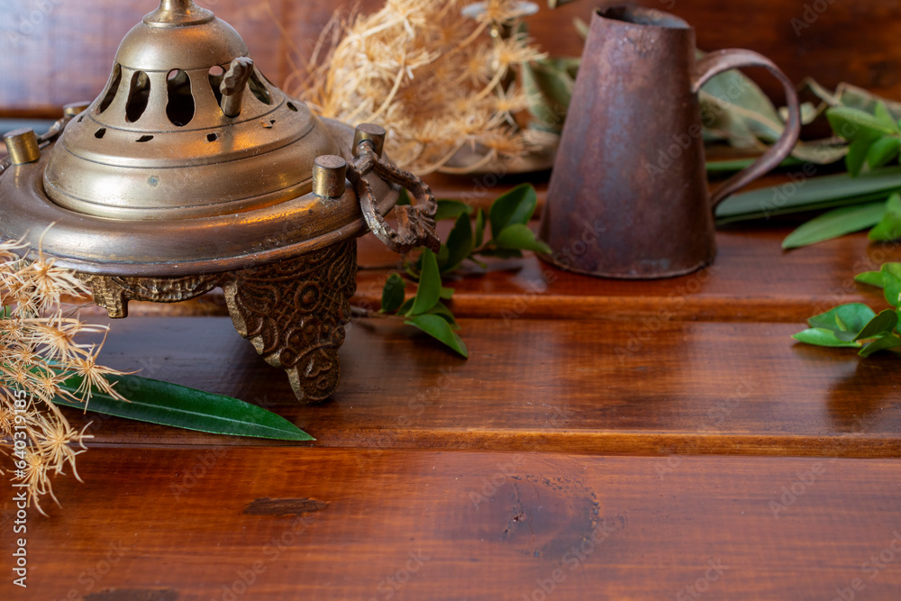 esoteric rituals, background with containers and green leaves with area ...