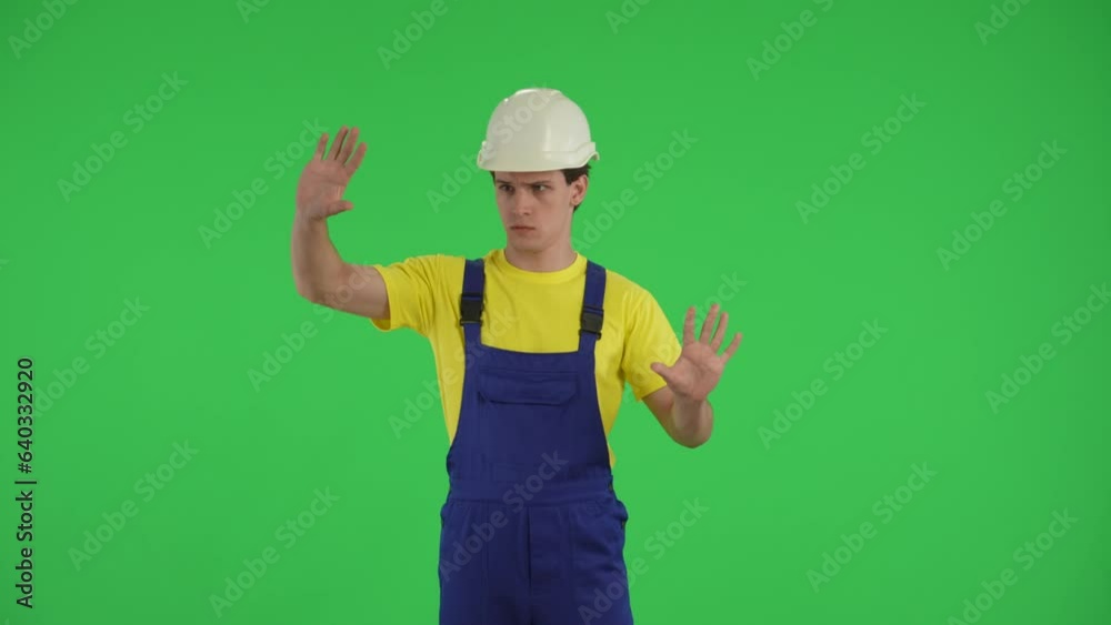 Medium green screen isolated chroma key video of a young construction ...