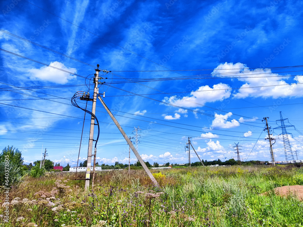 Old Power electric pole with limewire on blue sky with white clouds ...