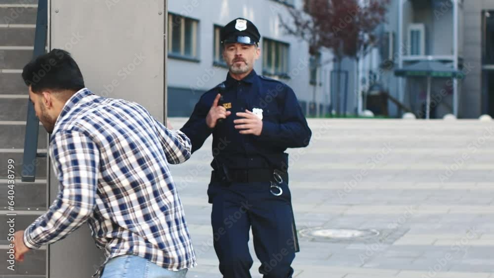Police officer chasing terrorist with weapon on city streets. Male ...